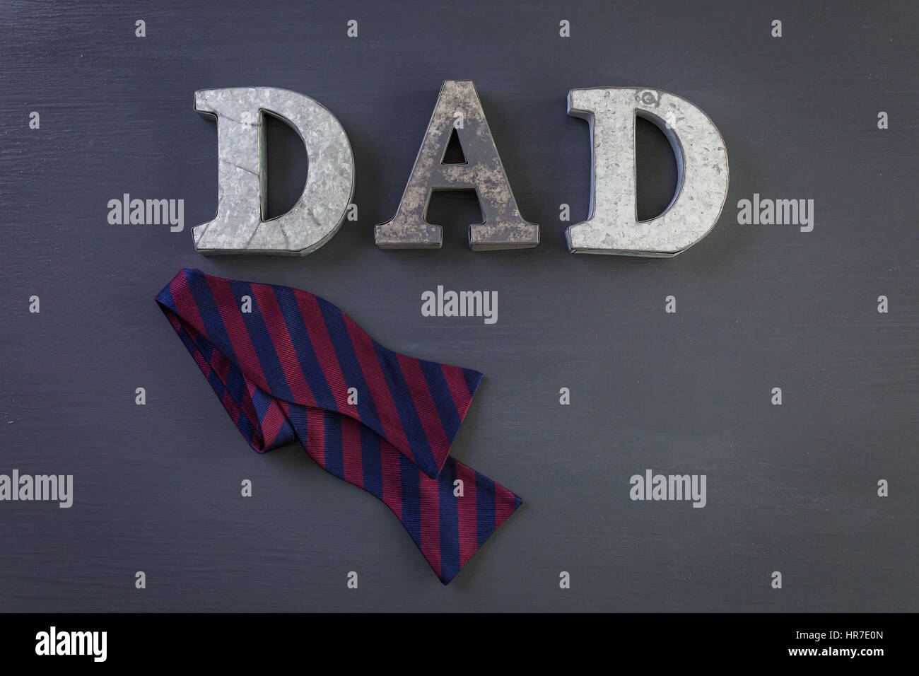 Metal letters DAD on a painted wood background Stock Photo - Alamy