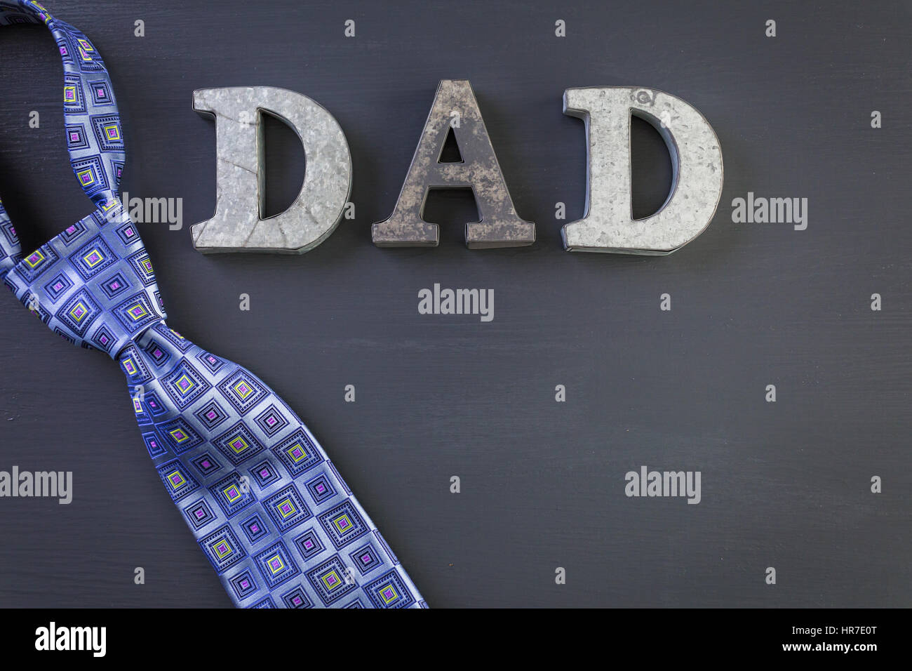 Metal letters DAD on a painted wood background Stock Photo - Alamy