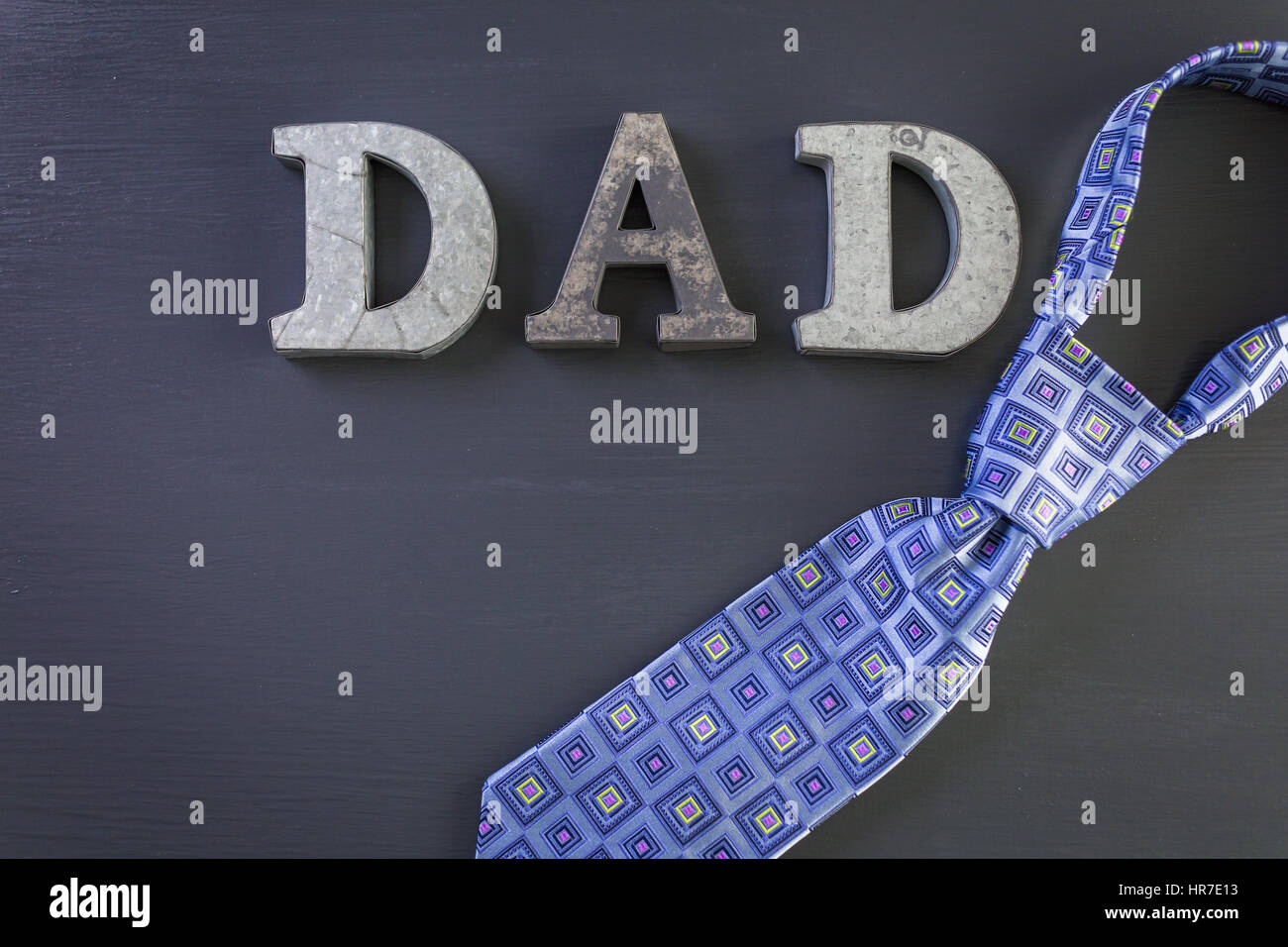 Metal letters DAD on a painted wood background Stock Photo - Alamy