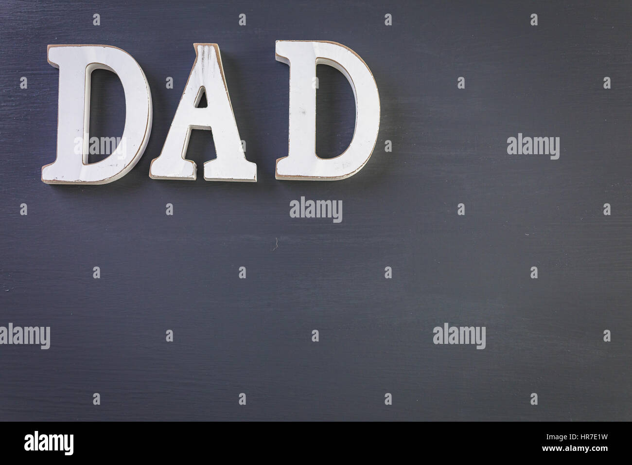 White letters DAD on a painted wood background Stock Photo - Alamy
