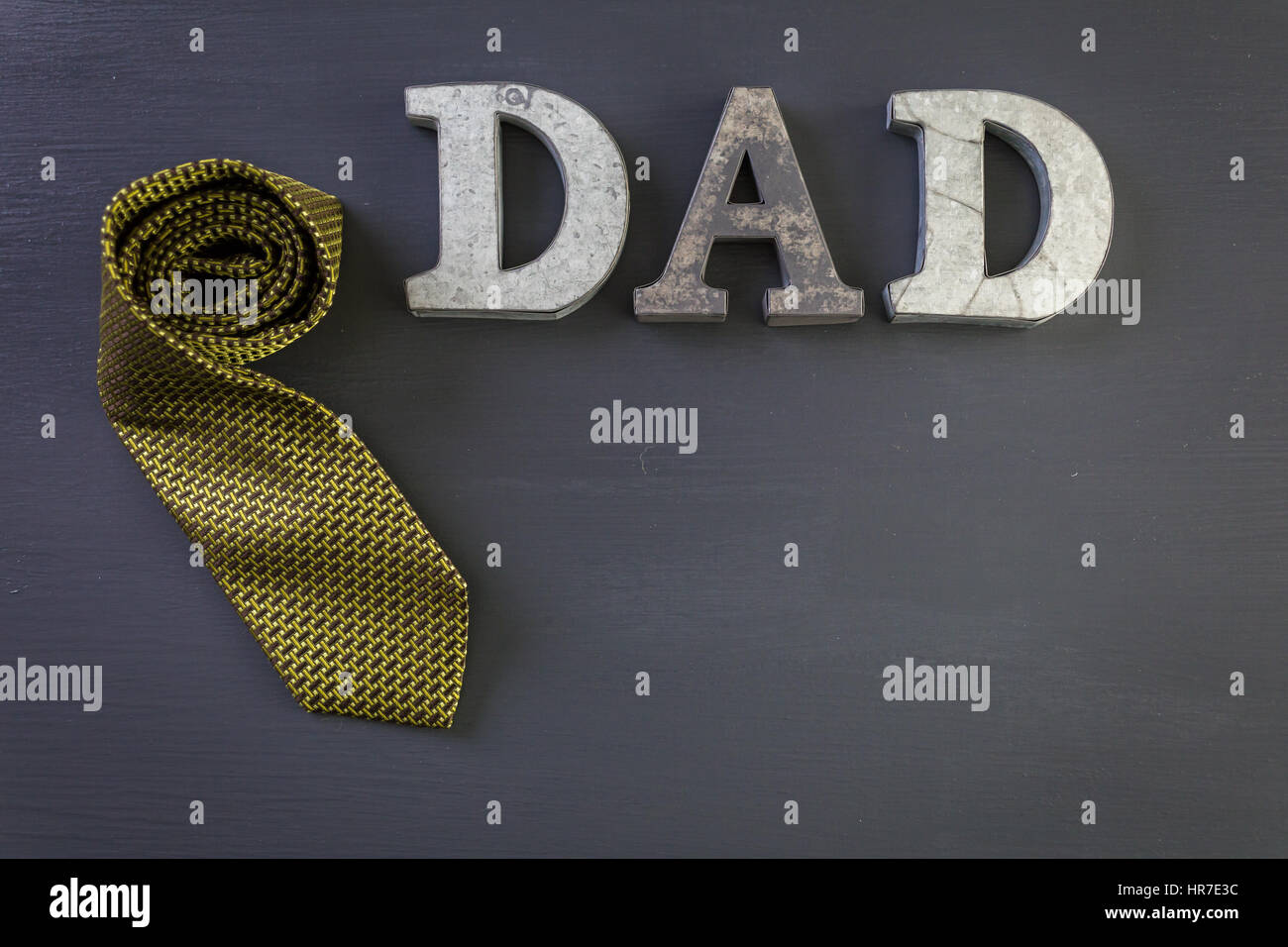 Metal letters DAD on a painted wood background Stock Photo - Alamy