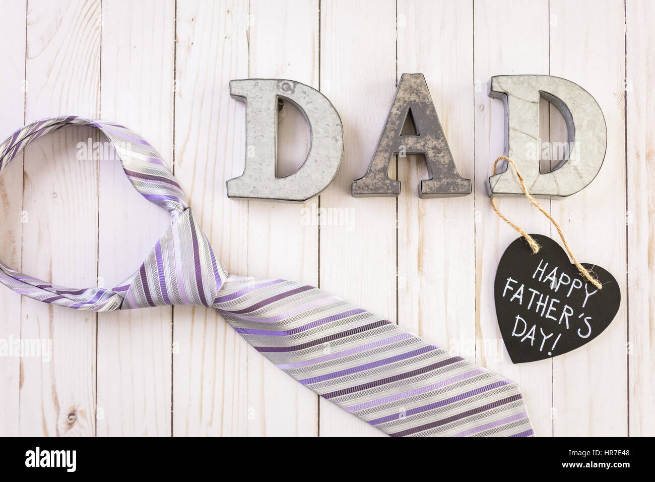 Metal letters DAD on a painted wood background Stock Photo - Alamy