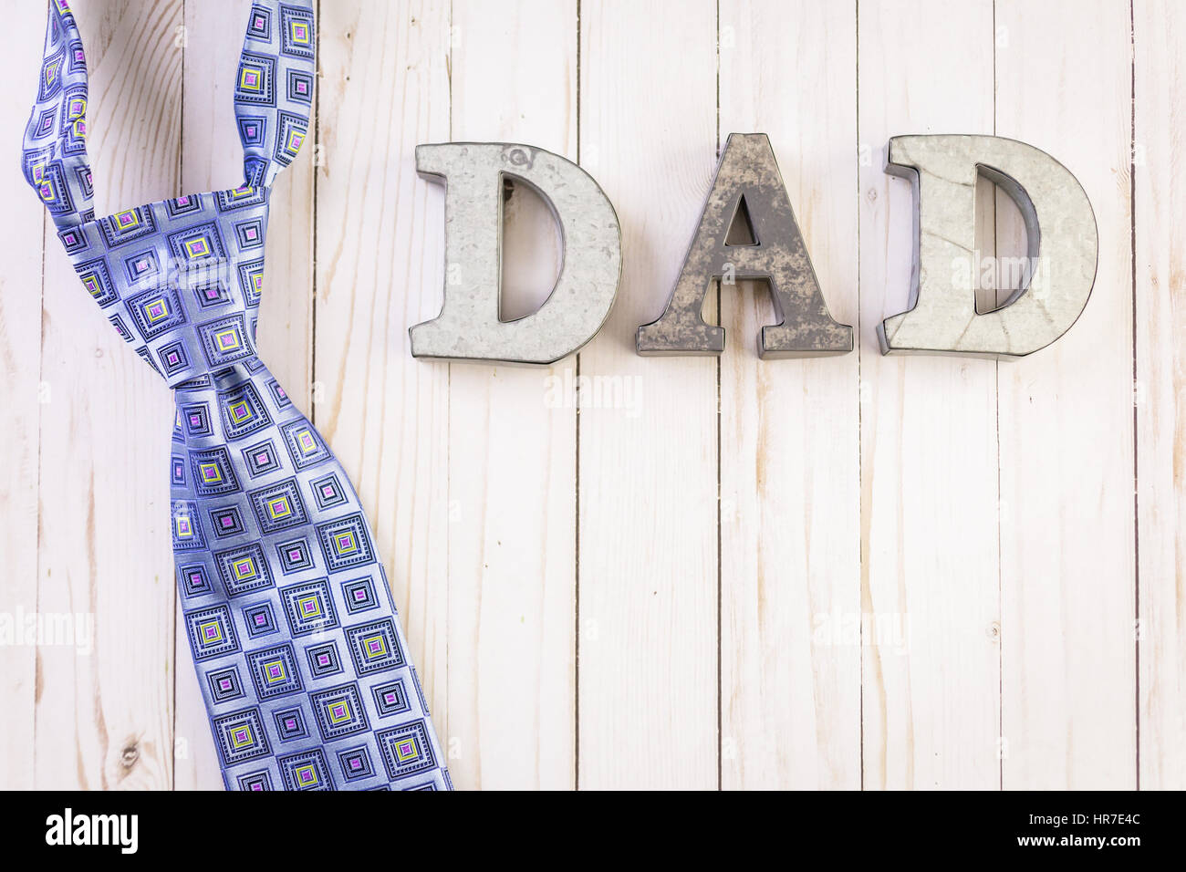 Metal letters DAD on a painted wood background Stock Photo - Alamy