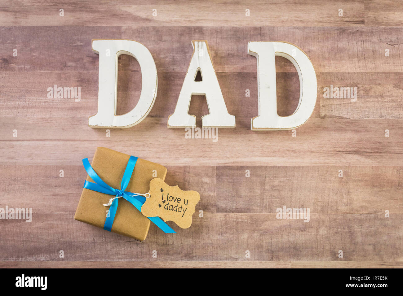 White letters DAD on a wood background Stock Photo - Alamy
