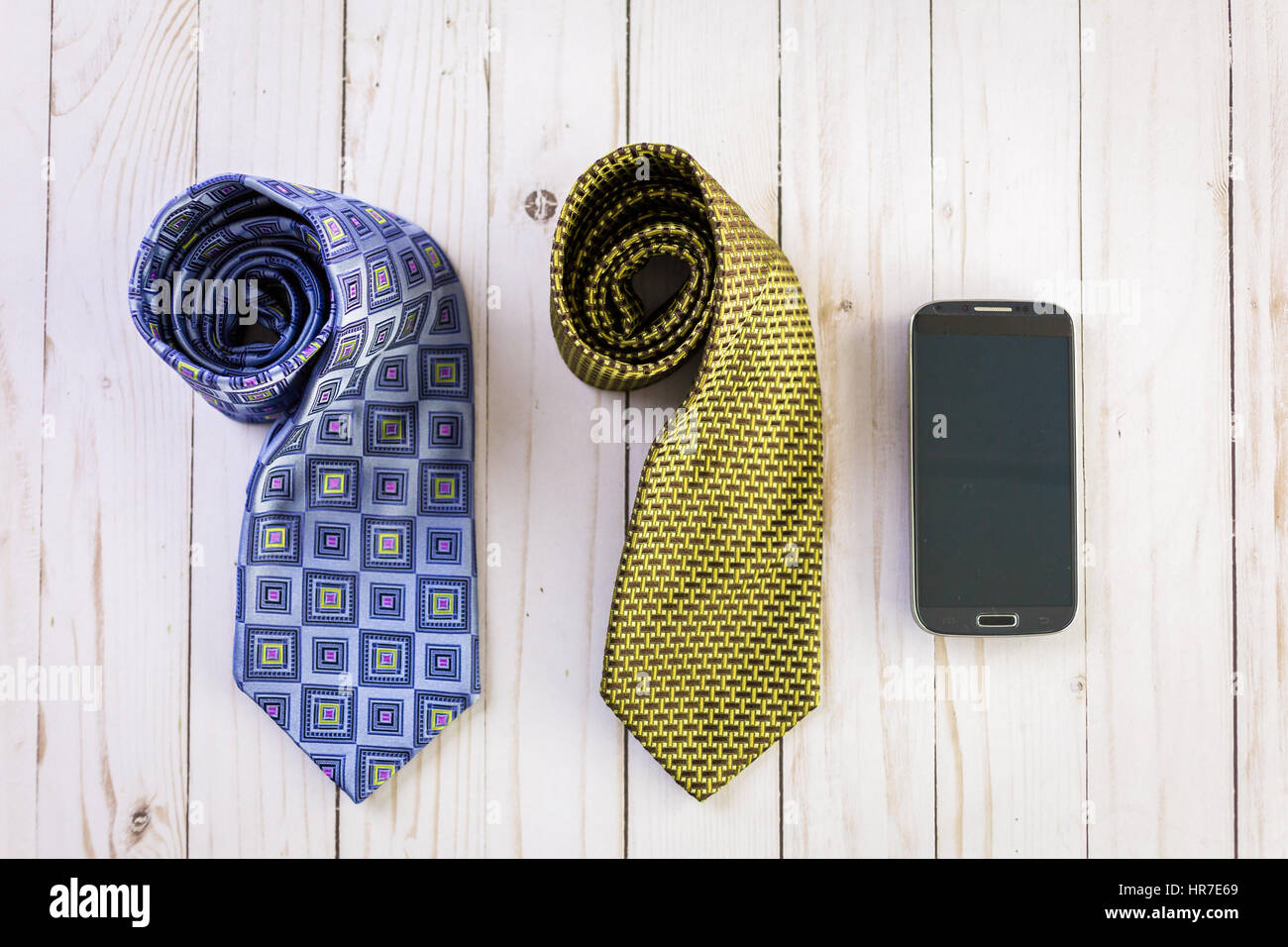 Men's tie with smart phone on a wood background Stock Photo - Alamy