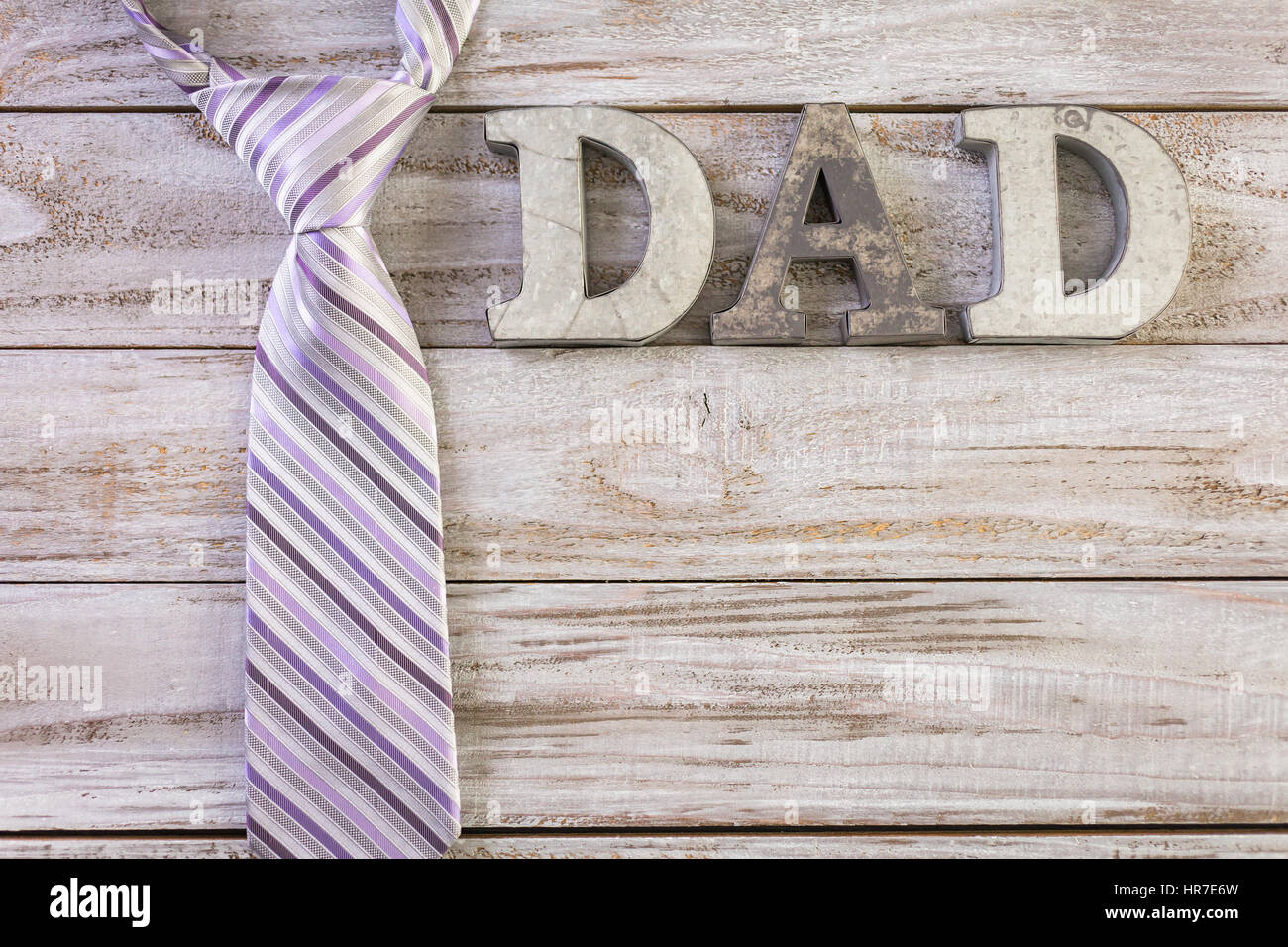 Metal letters DAD on a painted wood background Stock Photo - Alamy