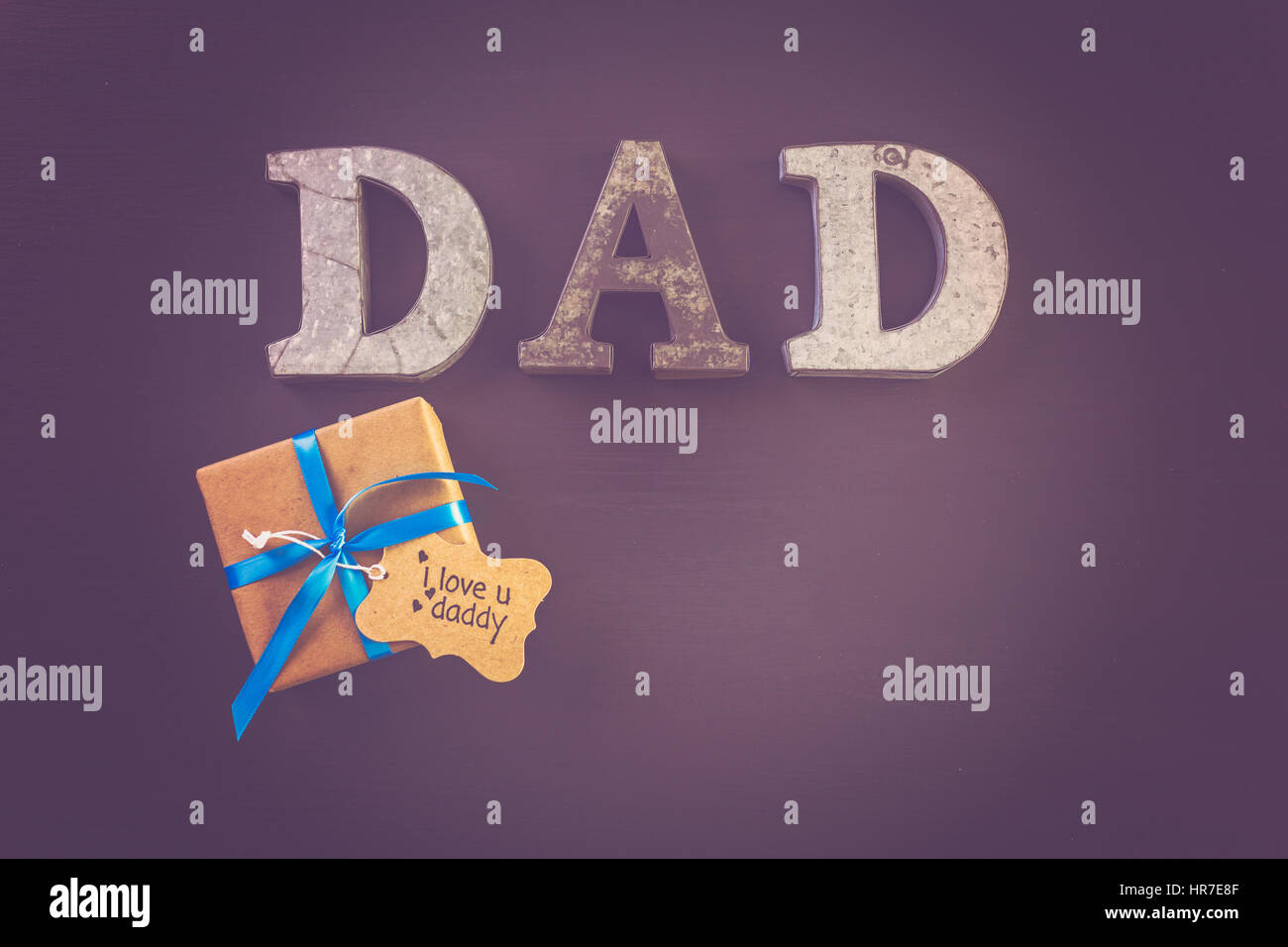 Metal letters DAD on a painted wood background Stock Photo - Alamy