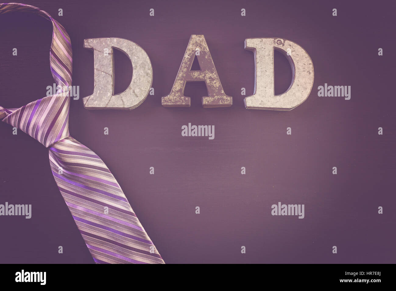 Metal letters DAD on a painted wood background Stock Photo - Alamy