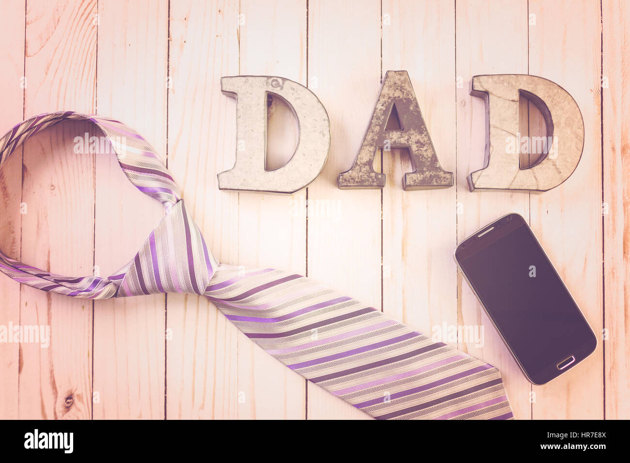 Metal letters DAD on a painted wood background Stock Photo - Alamy