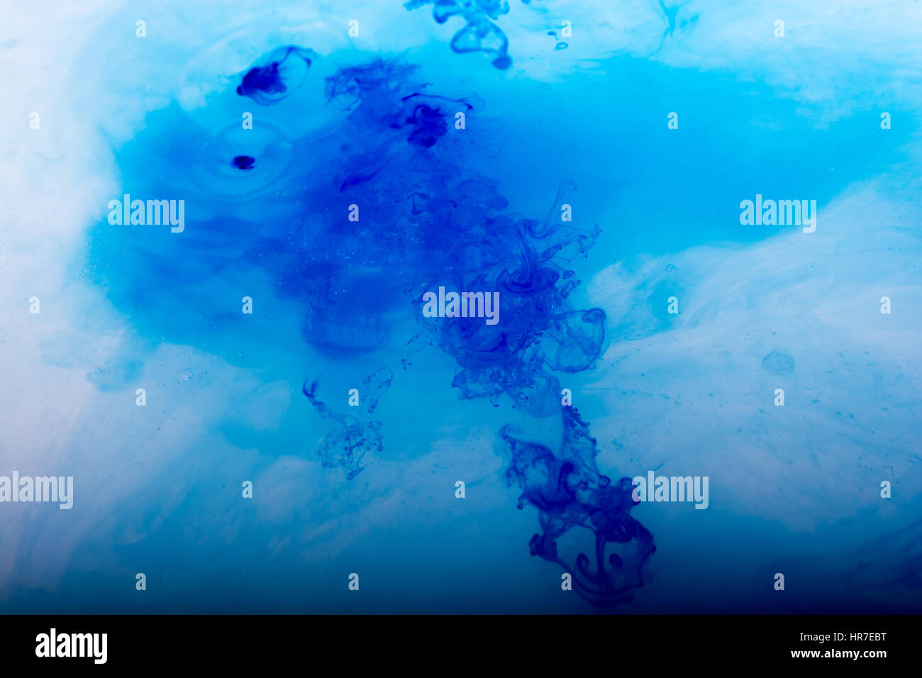 Watercolor paint dissolving in pure water Stock Photo - Alamy