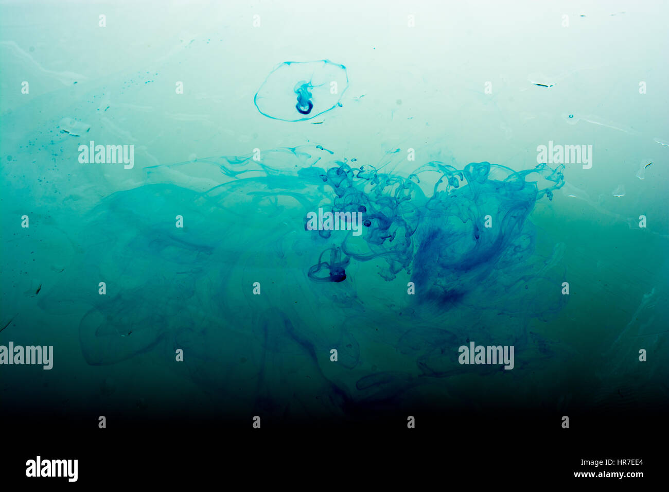 Watercolor paint dissolving in pure water Stock Photo - Alamy