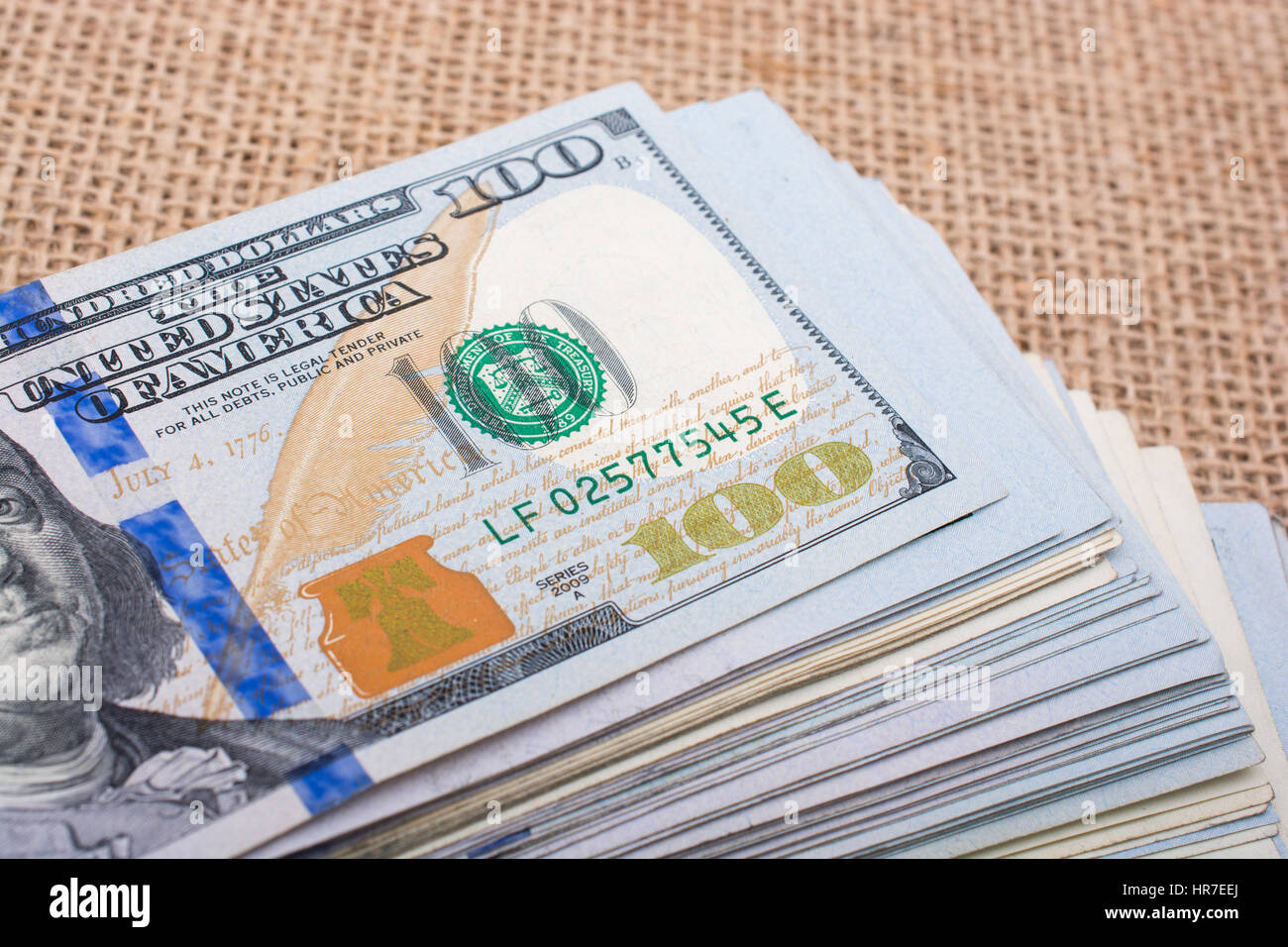 Banknote bundle of US dollar placed on a linen canvas Stock Photo - Alamy