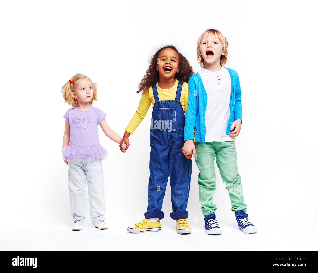 Studio portrait of children against white background: full body shot of ...