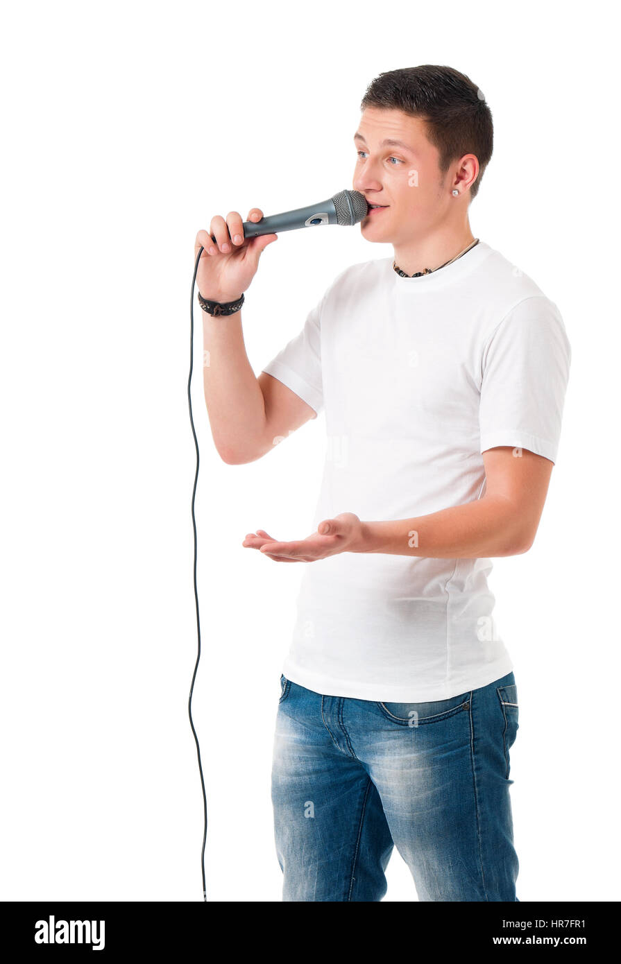 Young modern man with microphone isolated on white background Stock ...