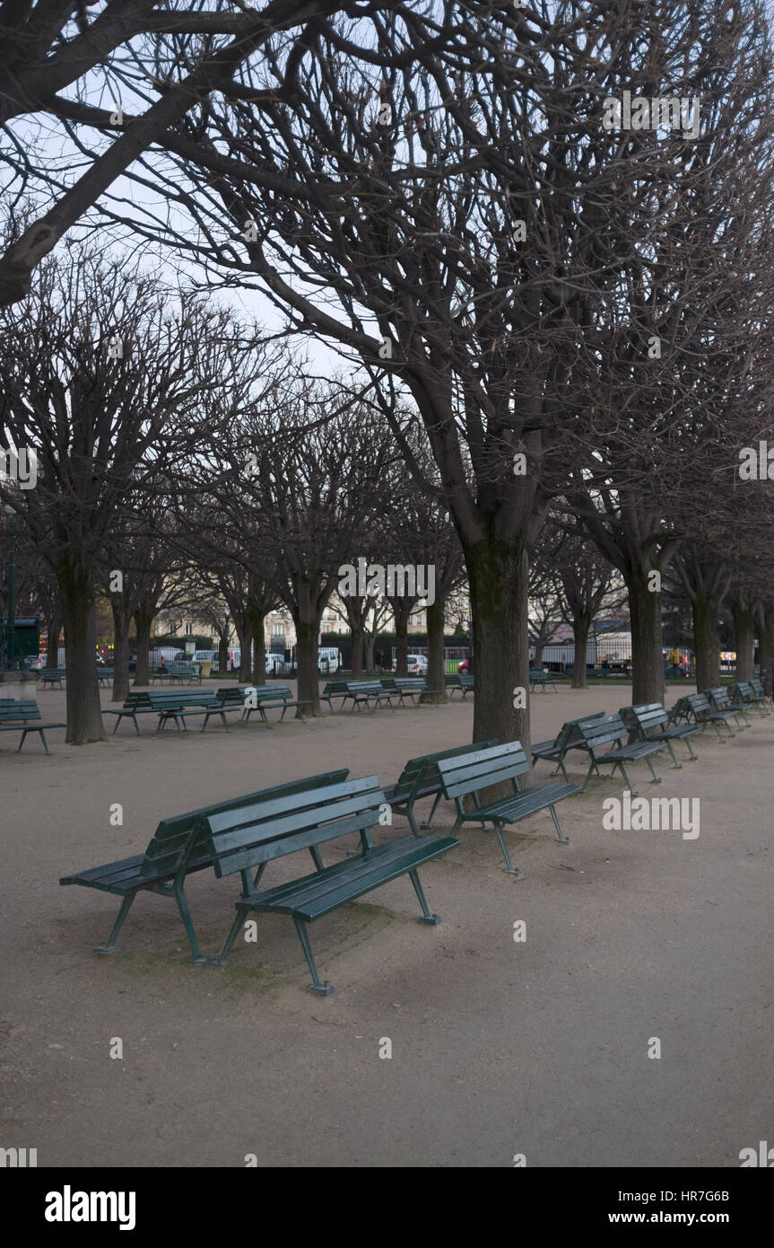 Line up of benches in a Parisian park next to the Notre Dame de Paris ...