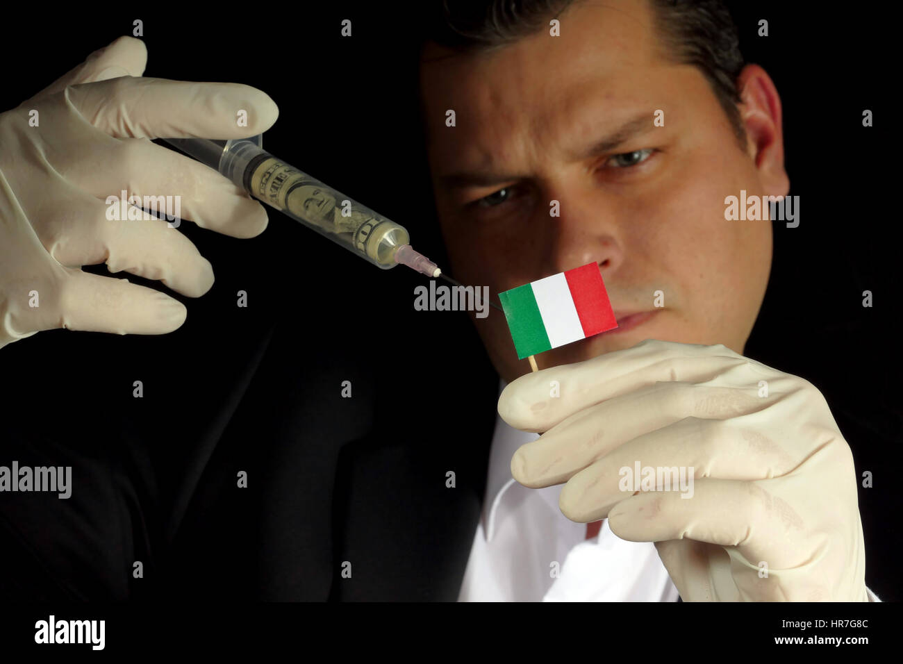 Young businessman gives a financial injection to Italian flag isolated ...