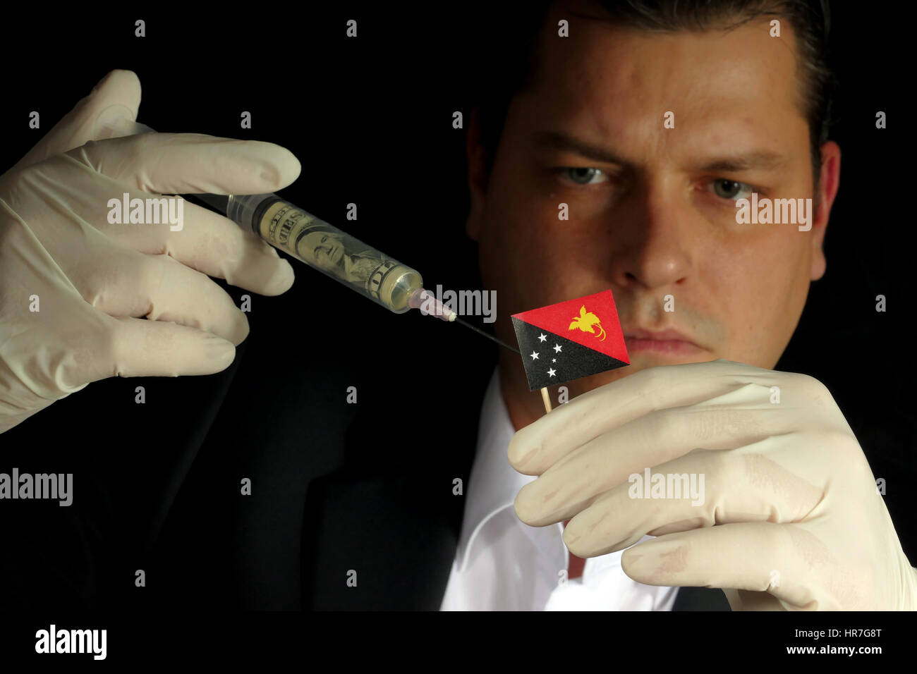 Young businessman gives a financial injection to Papua New Guinea flag ...