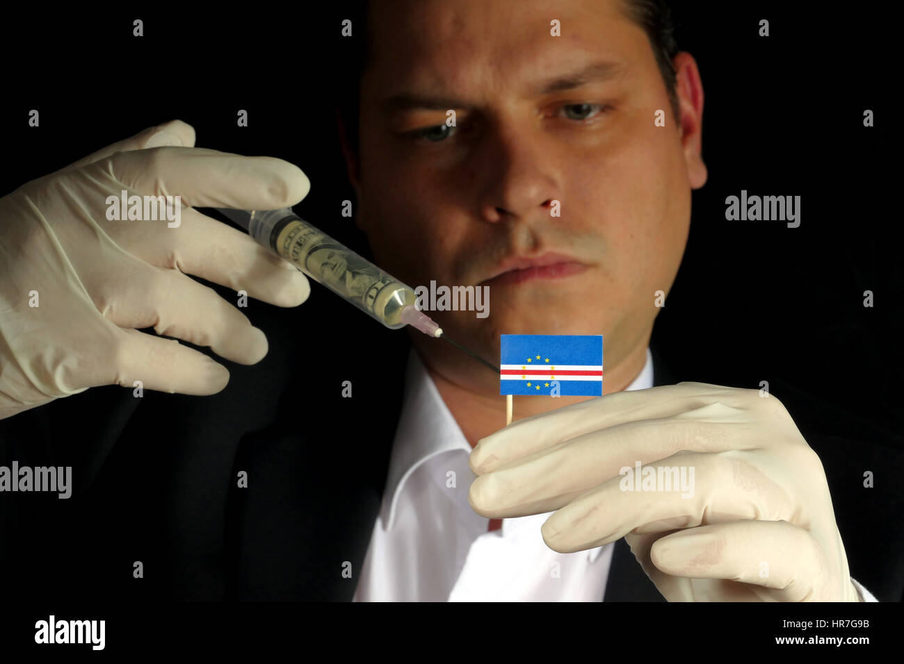 Young businessman gives a financial injection to Cape Verde flag ...