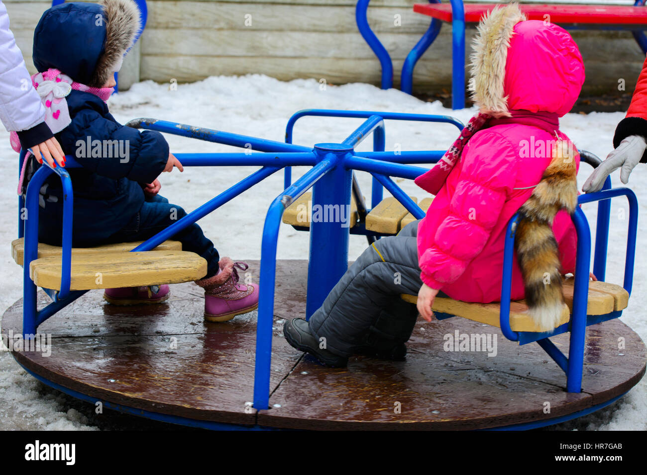 Children play on the playground in the winter on a holiday Maslenitsa ...