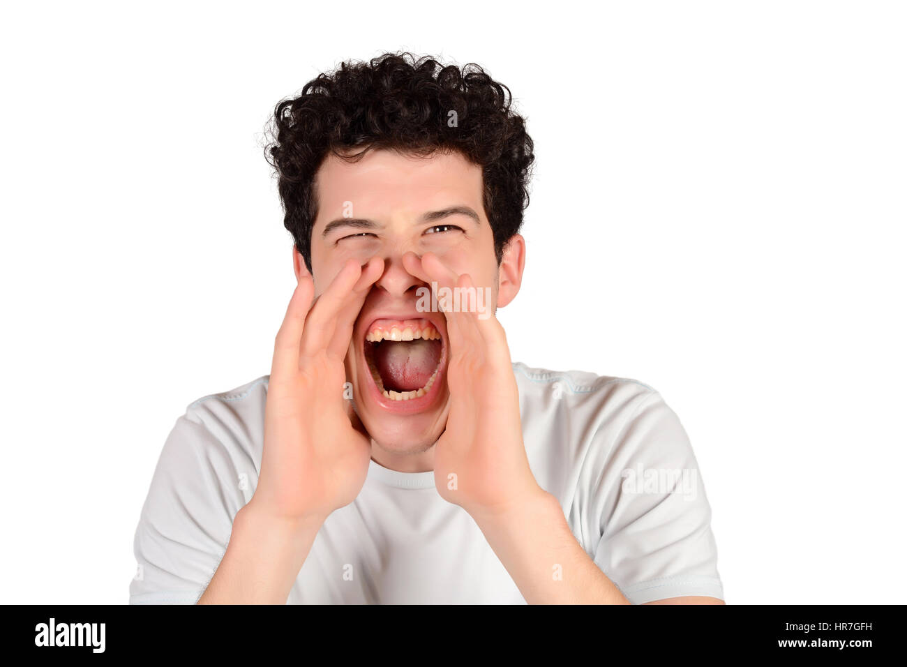 Portrait of a young man shouting. Isolated white background Stock Photo ...