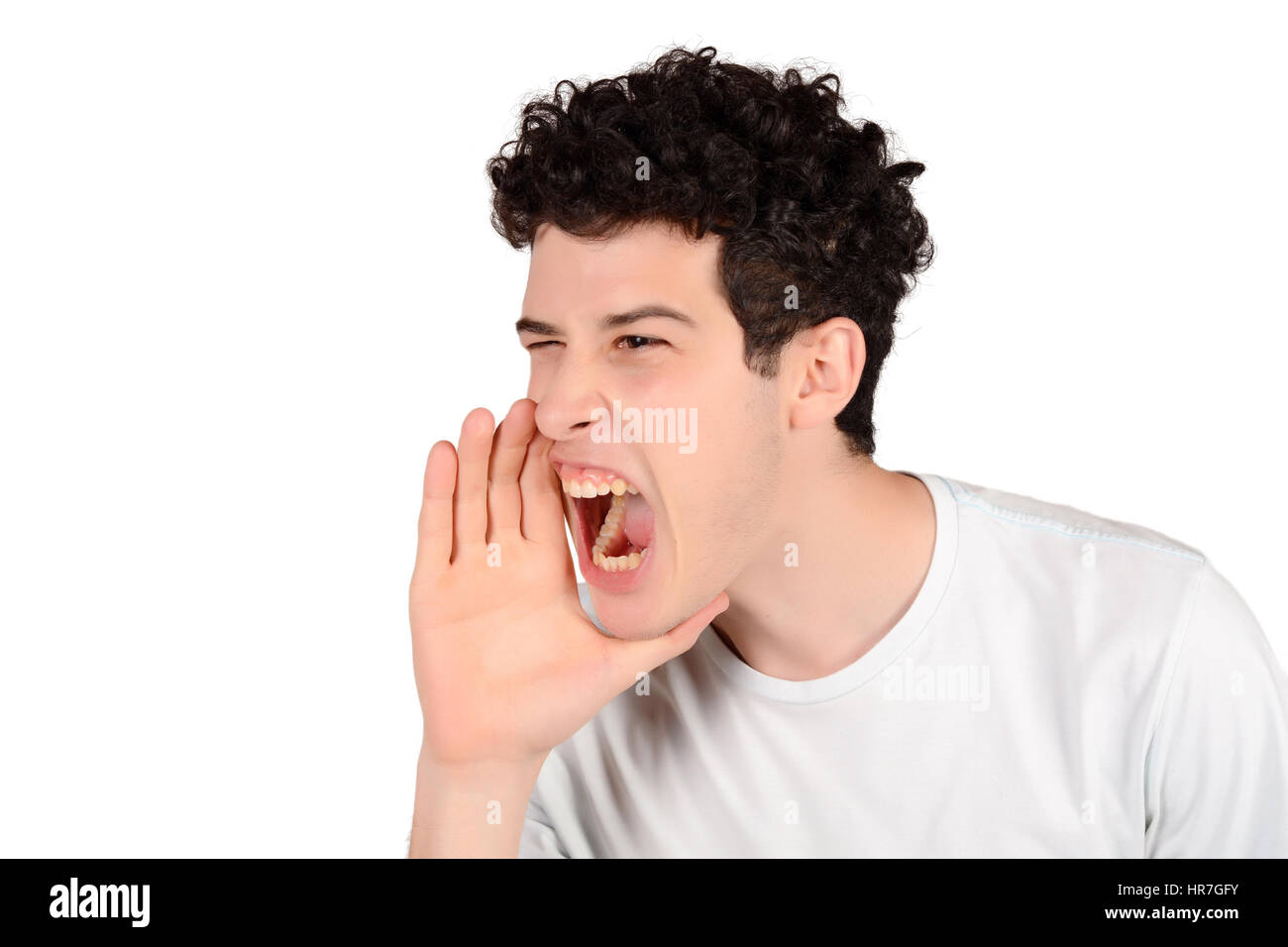 Portrait of a young man shouting. Isolated white background Stock Photo ...