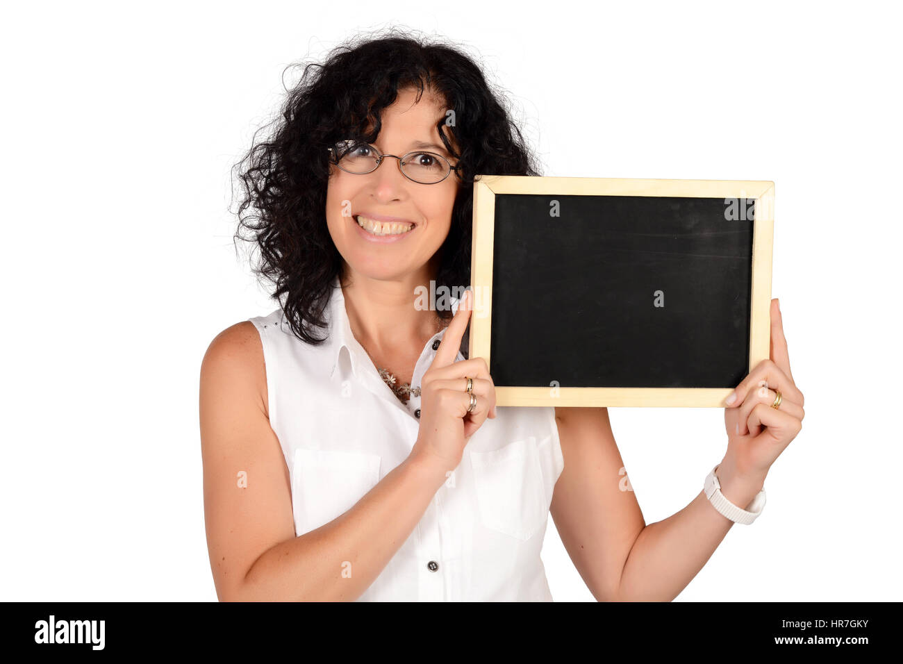 Portrait of beautiful school teacher holding an empty chalkboard ...