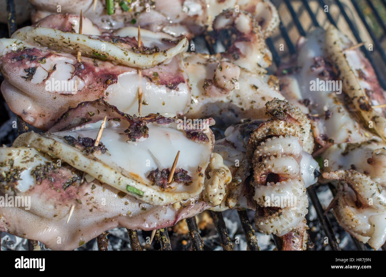 Cuttlefish on the BBQ by the beach, South Corfu, Greece Stock Photo - Alamy