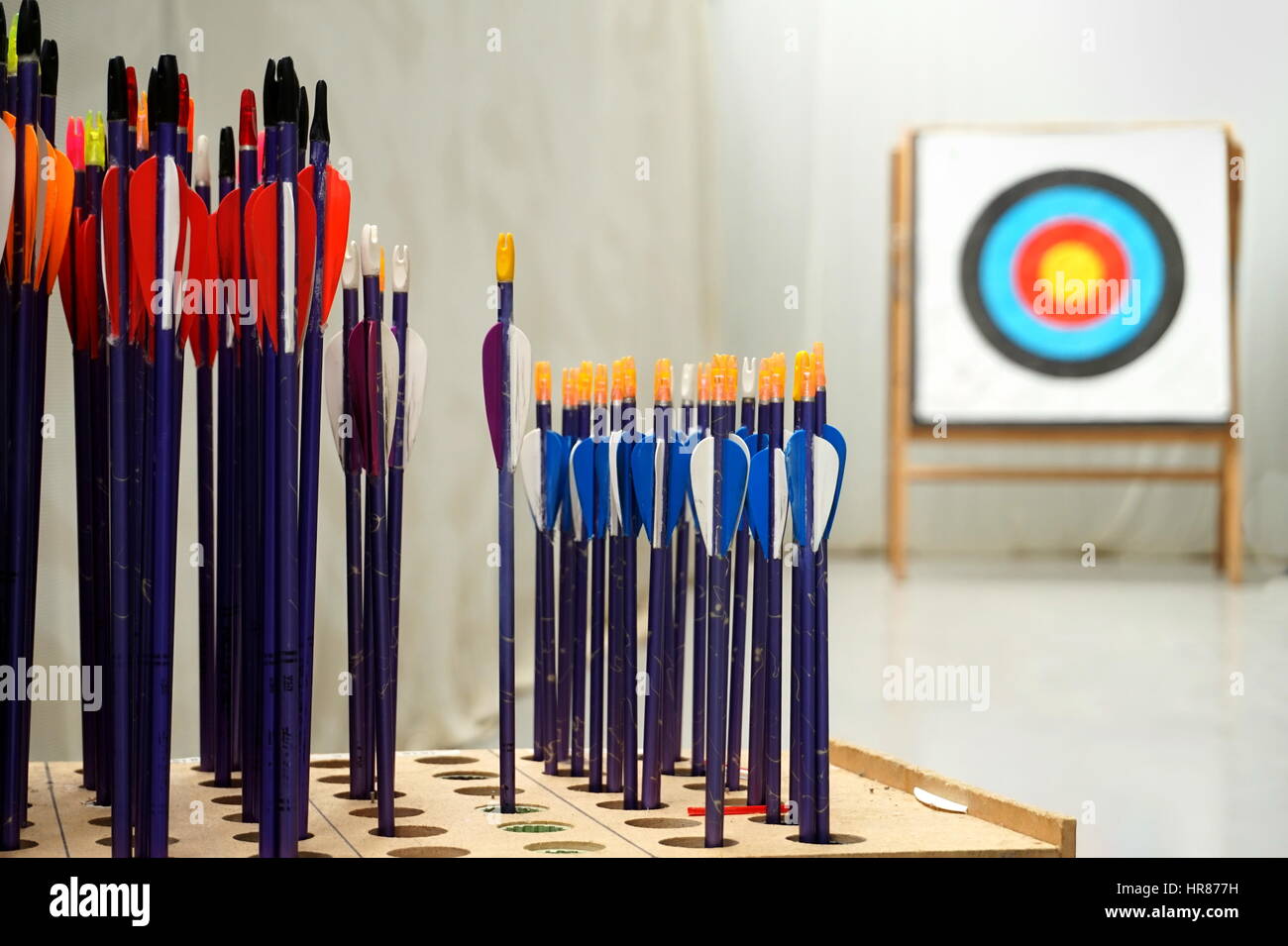 Archery arrows with targets in out of focus background Stock Photo - Alamy