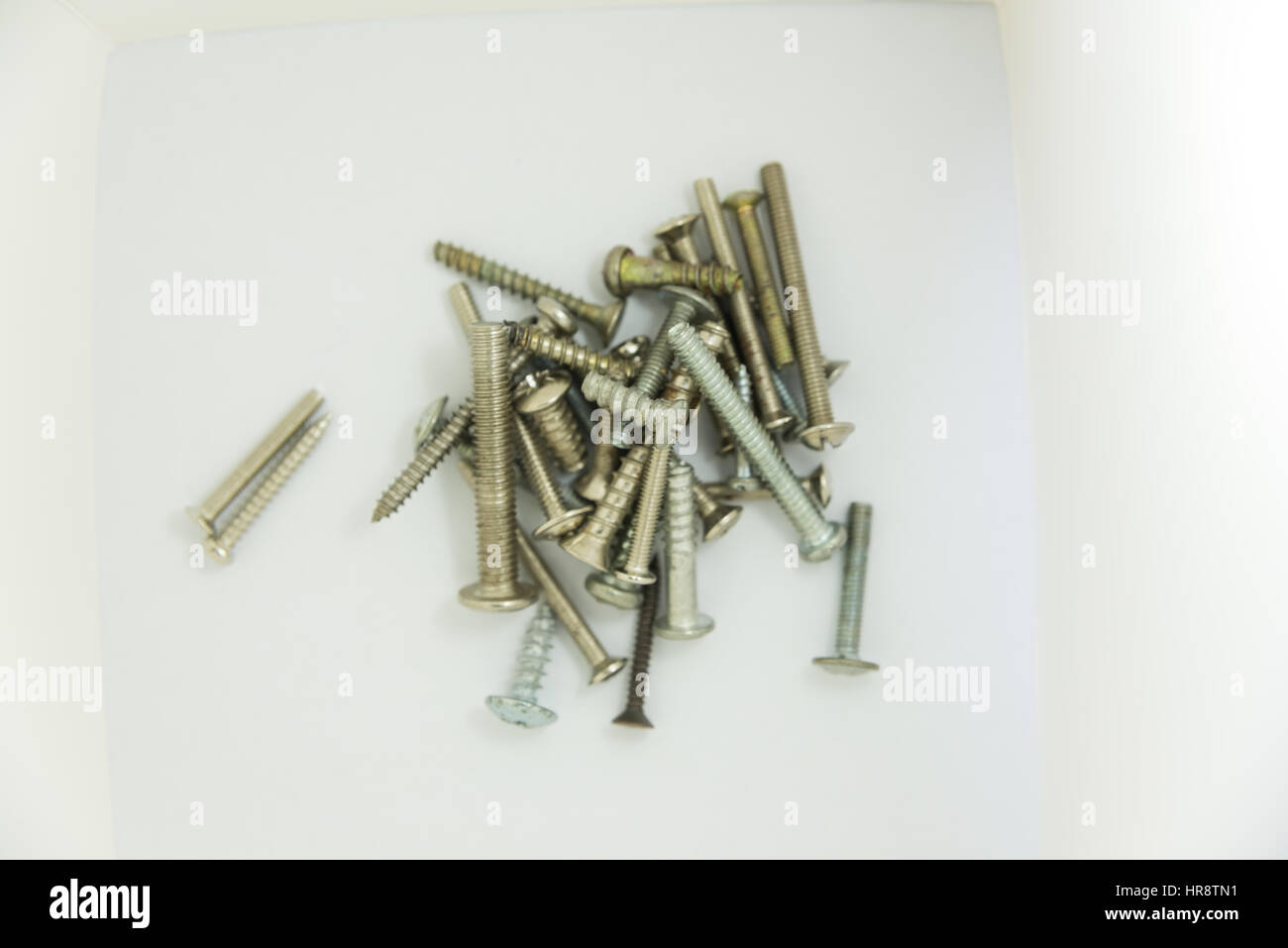 Some screws on the desk Stock Photo - Alamy