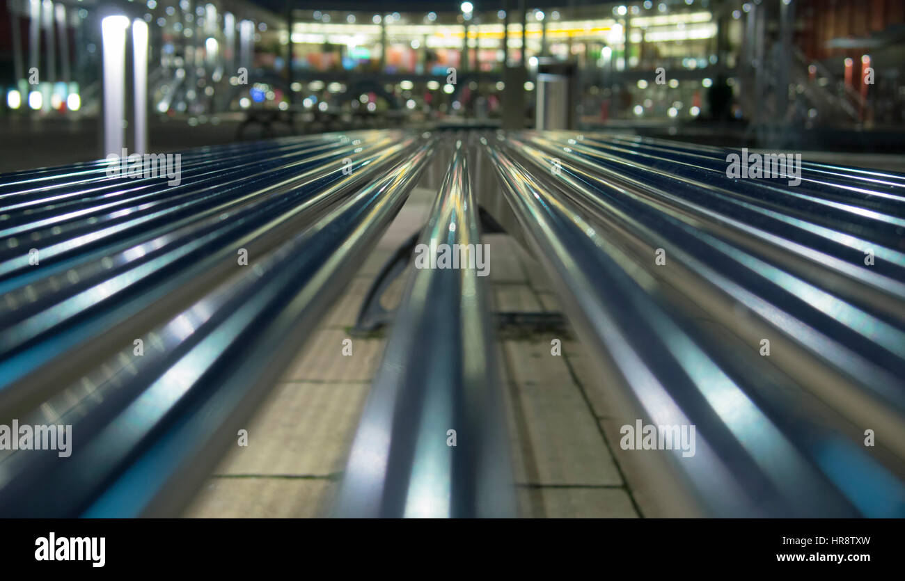 in the night shiny metal lines blurred background Stock Photo - Alamy