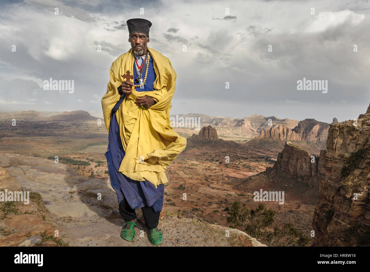 Portrait of an orthodox monk with a cross in the mountains of Gheralta ...