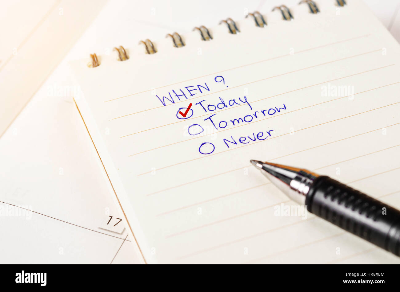 Choosing the right date on diary with calendar page with pen. Time ...