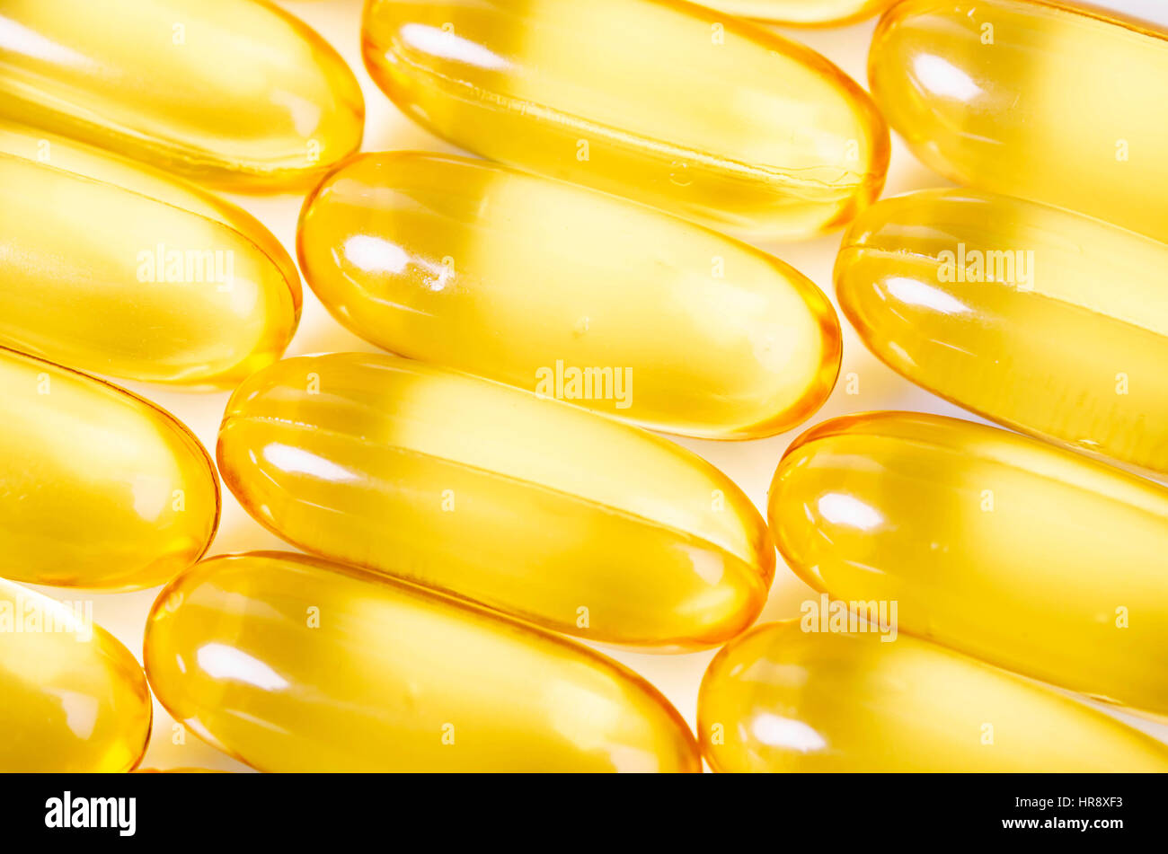 Close up Fish Oil texture on white background, Top view Stock Photo - Alamy
