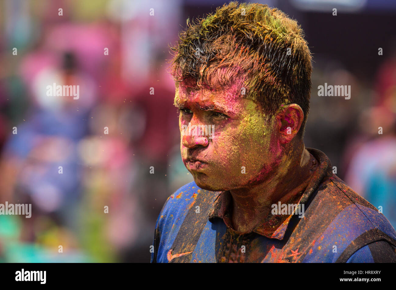 Dubai, UAE - Mar 21, 2014: People throwing colorful paint and powder ...