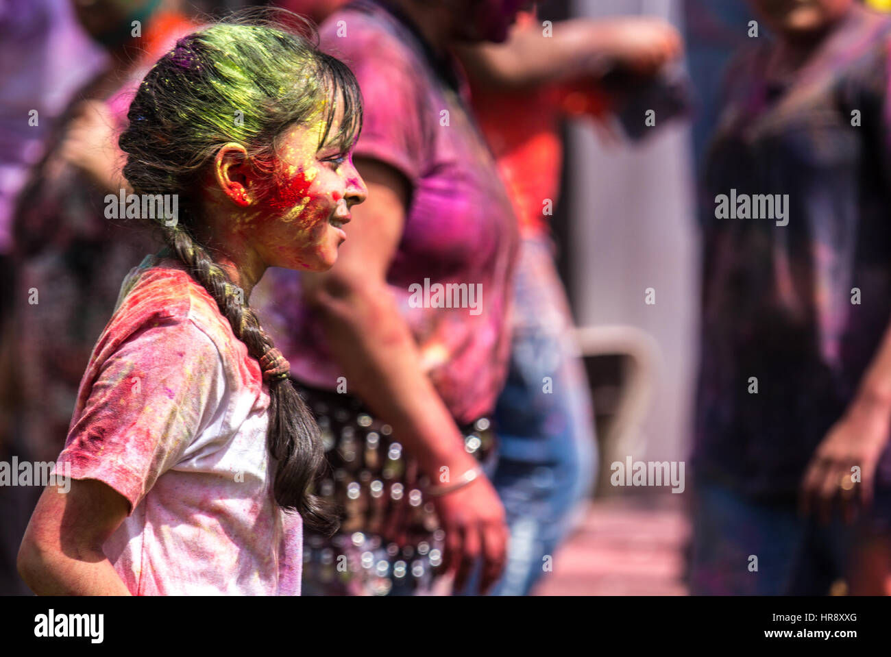 Dubai, UAE - Mar 21, 2014: People throwing colorful paint and powder ...
