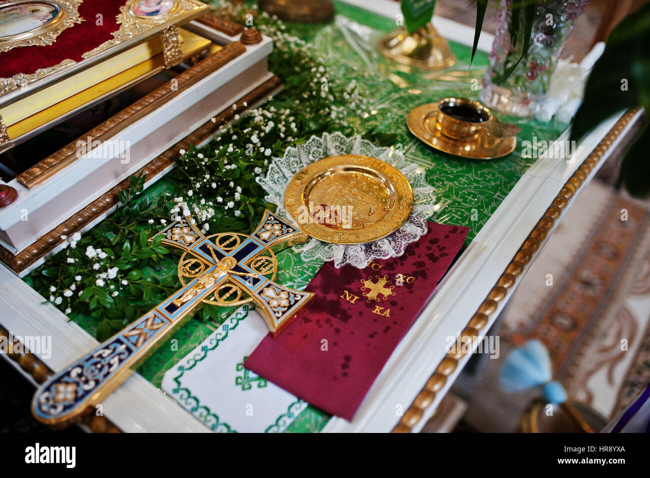 Wedding rings at discus with cross at church Stock Photo - Alamy
