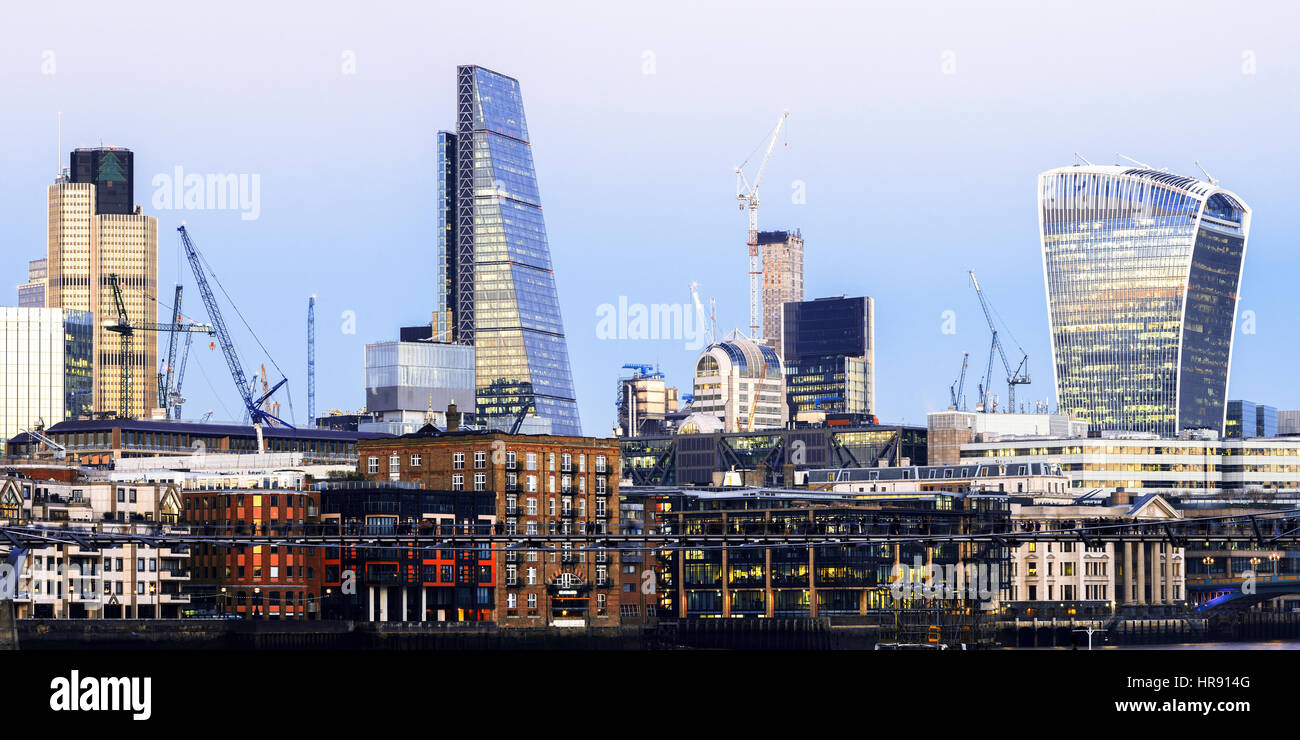 The Millennium footbridge and the business district of London ...