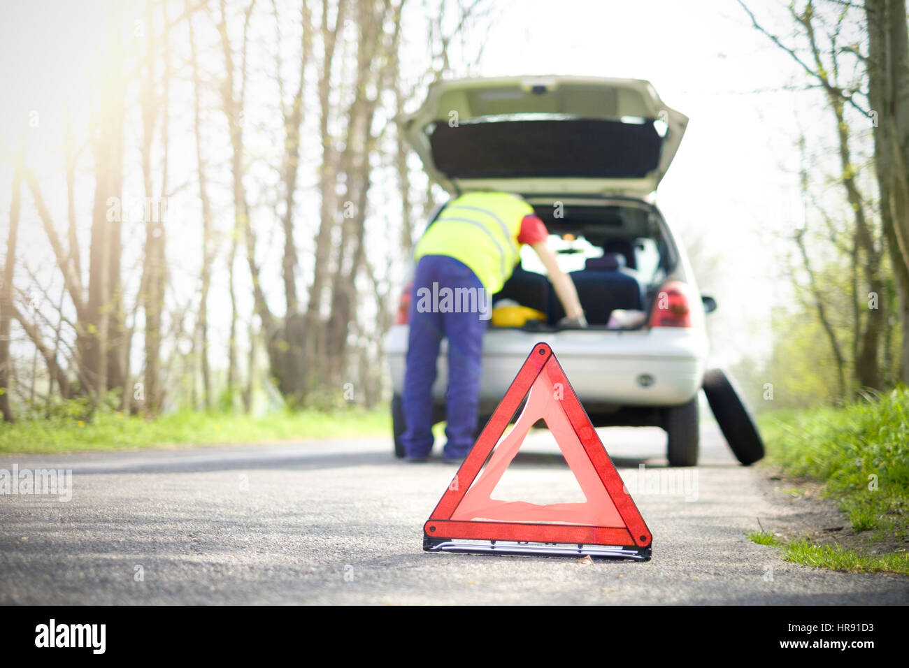 man fixing a car problem after vehicle breakdown on the road Stock ...