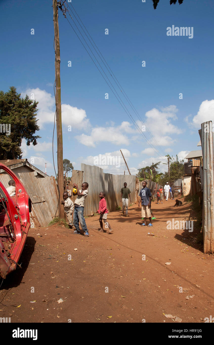 Kids playing football on the street, Kibera slums, Nairobi, Kenya, East ...
