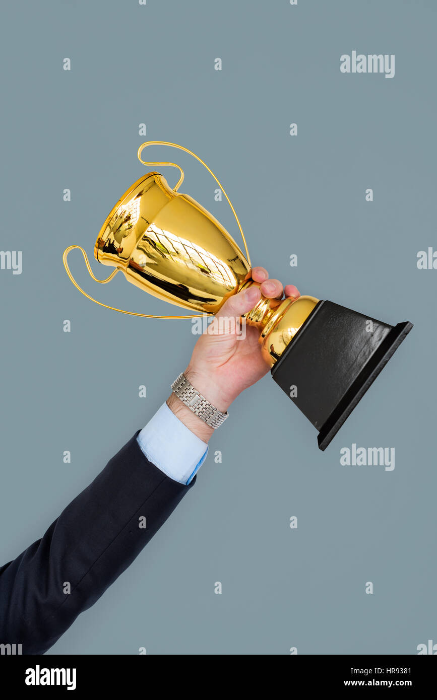Hand Holding Trophy