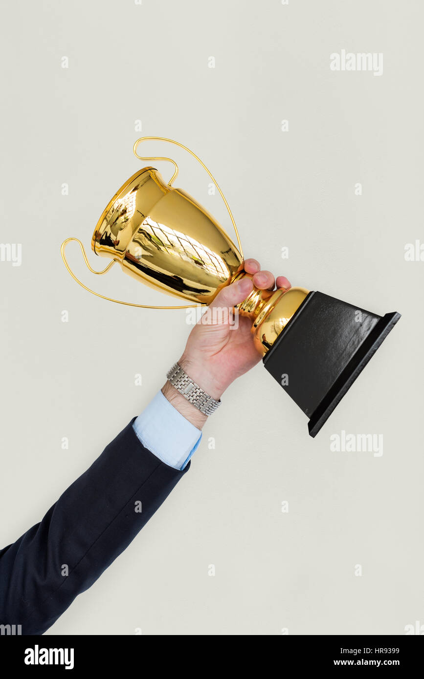 Business Man Holding Trophy Stock Photo - Alamy