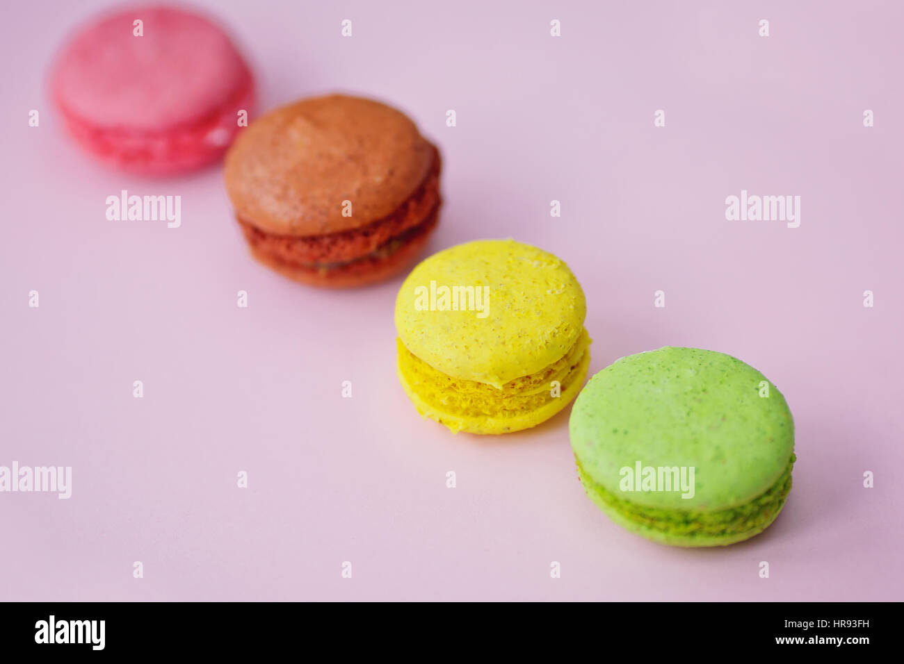 colorful macaroons on the pink background Stock Photo - Alamy