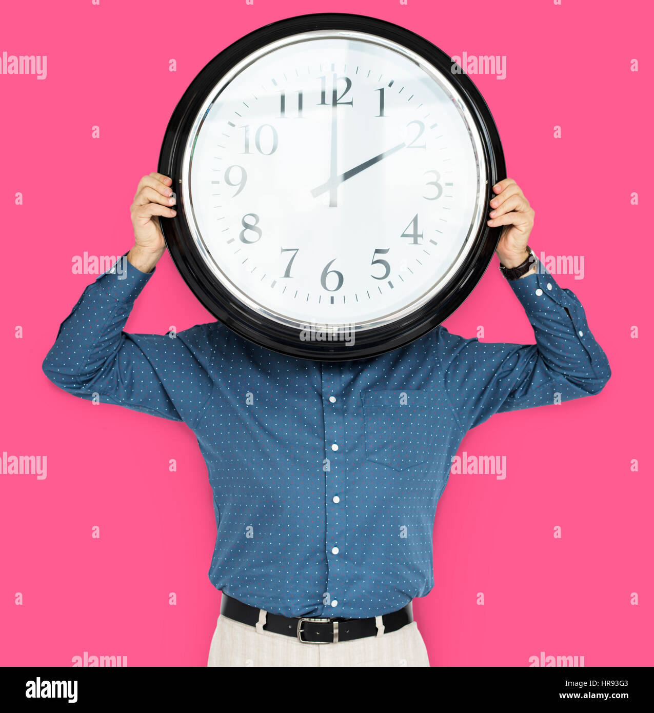 Man Holding Clock Covering Face Stock Photo - Alamy