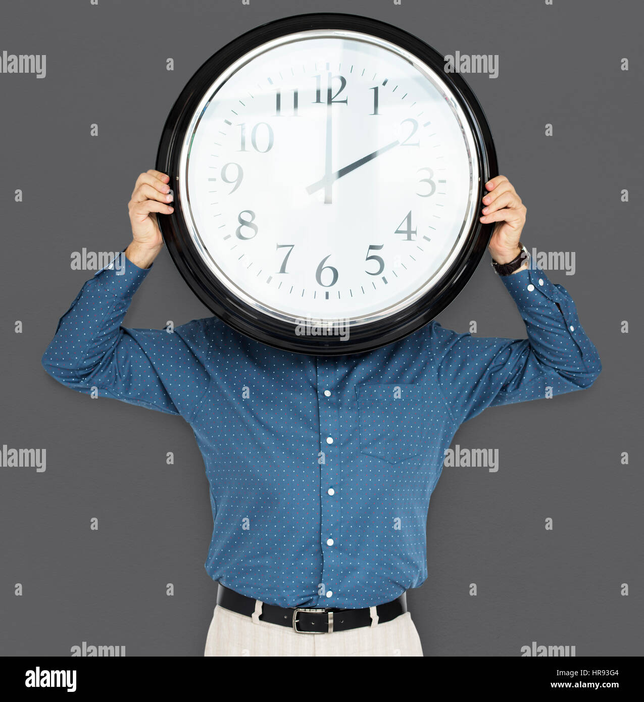 Man Holding Clock Covering Face Stock Photo - Alamy