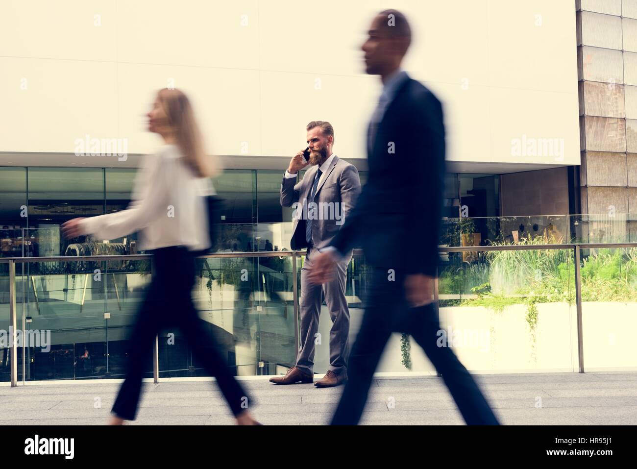 Businessmen Calling Phone People Walk Stock Photo - Alamy