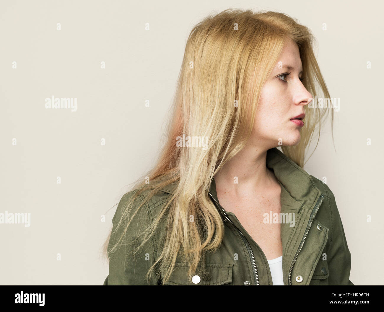 Blonde young woman studio portrait Stock Photo - Alamy