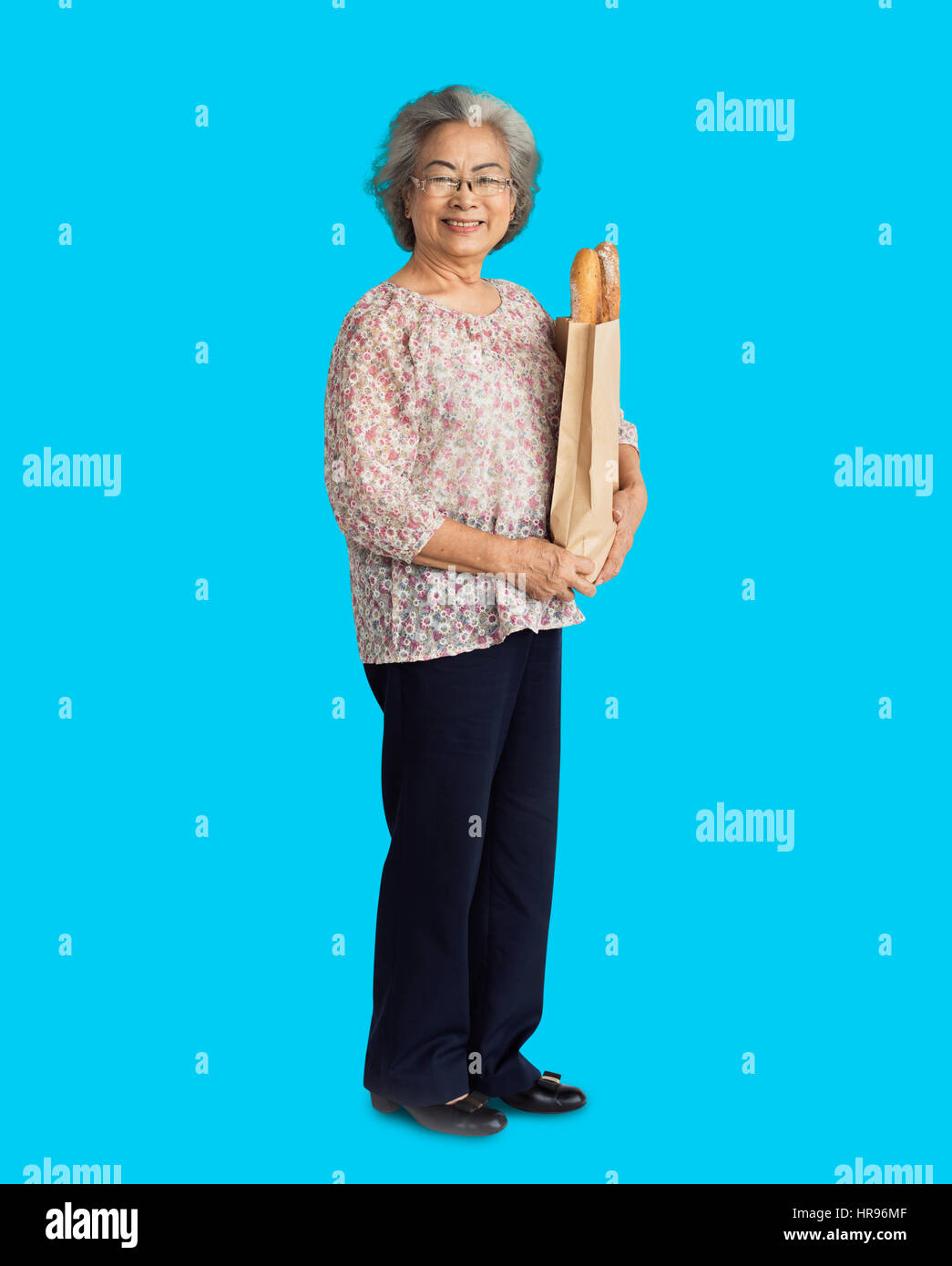 Mature Asian Lady Holding Bread Stock Photo - Alamy
