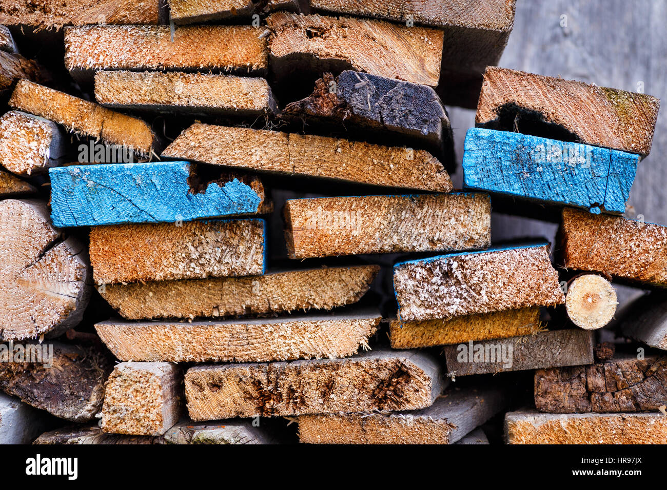 Stack of sawn boards with slices of different shapes. Two planks ...