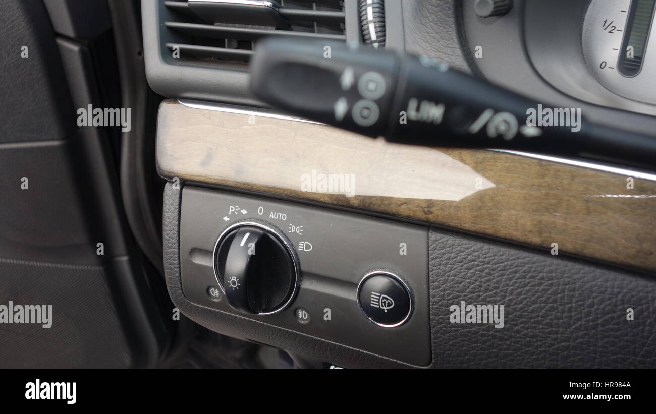 Close up automatic cruise control - tempomat command with blurred gages ...