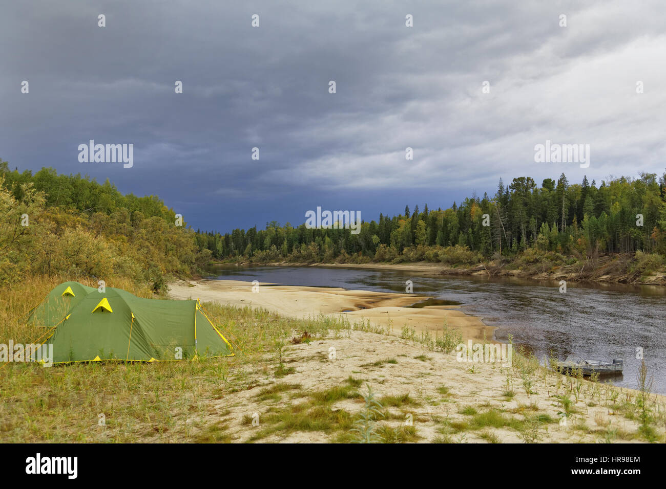 Tents and boat on the river Big Yugan taiga, Siberia Stock Photo - Alamy